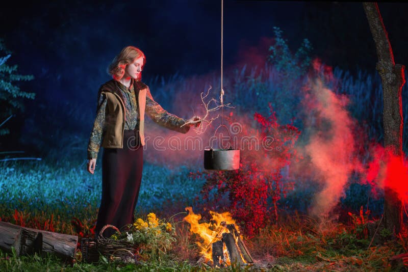 Witch by Fire in Night Forest Prepares Magic Potion Stock Photo - Image ...