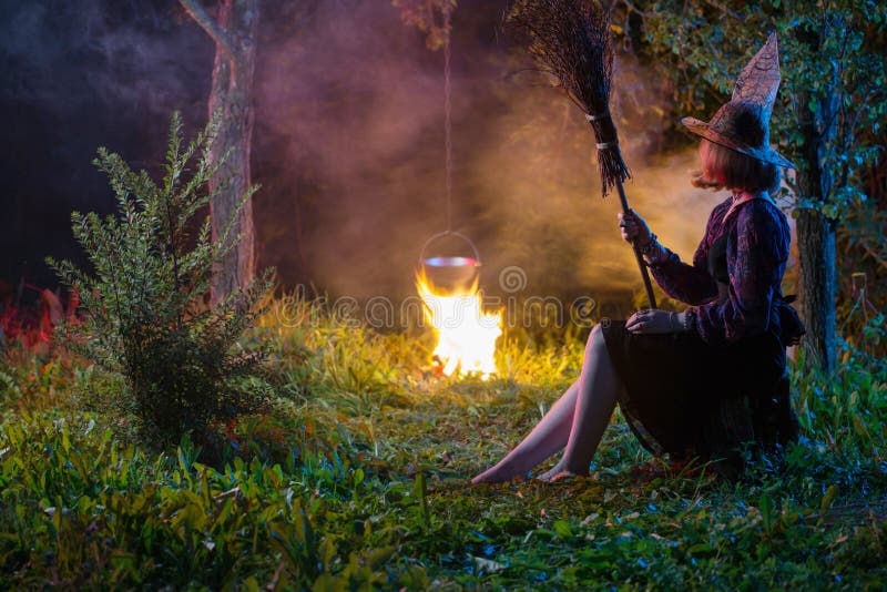 Young Witch by Fire in Night Forest Stock Photo - Image of females ...