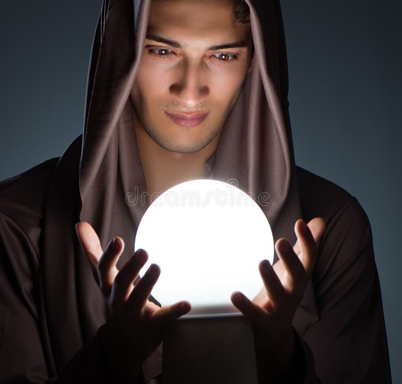 Young Wizard with Crystal Ball in Dark Room Stock Image - Image of ...
