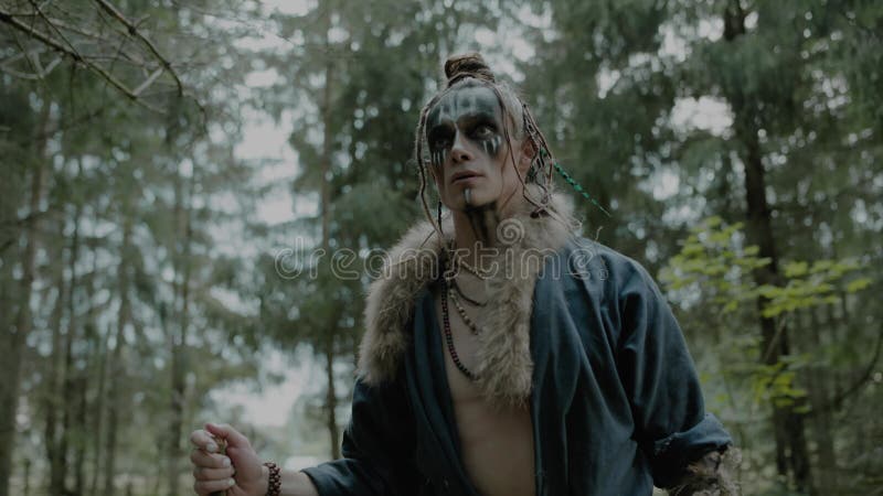 Young Wizard with Stick Stands Looking Around in Old Forest Stock ...