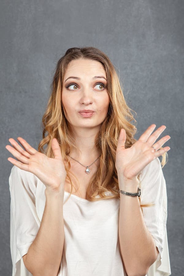 Young Woman Acting Surprised Stock Image - Image of flirt, female: 50025809