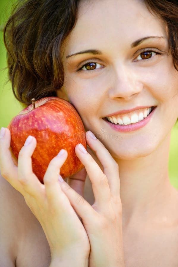 Young woman with apple stock photo. Image of face, apples - 15452804