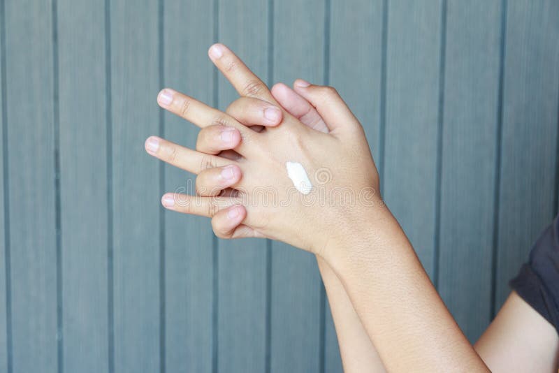 Young Woman Applying Hands Cream Stock Photo - Image of palm, applying ...