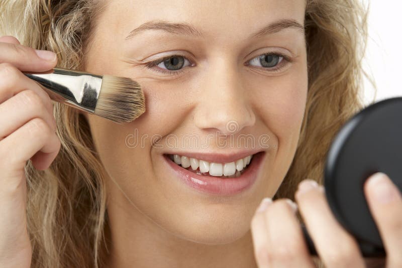 Young Woman Applying Make-Up Stock Photo - Image of head, mirror: 7940824