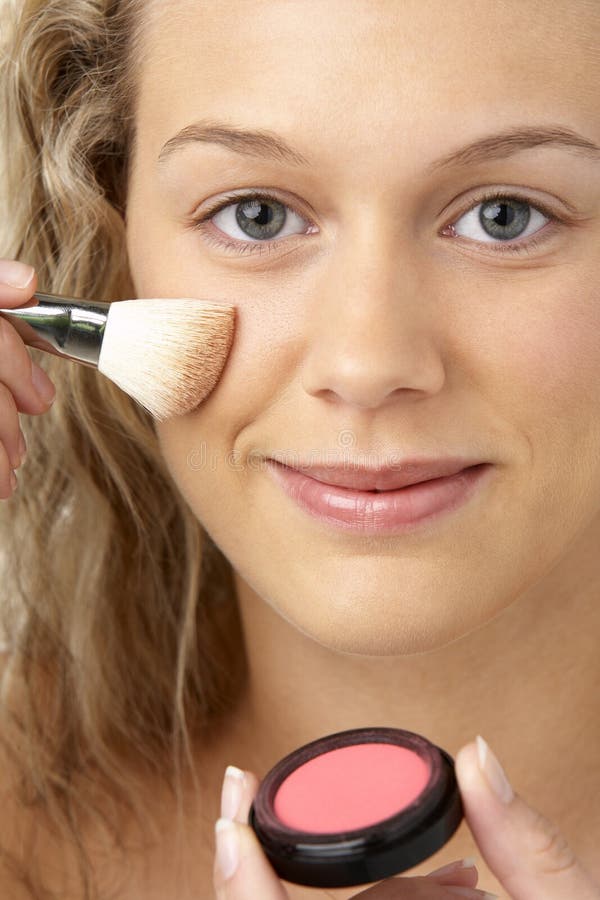 Young Woman Applying Make-Up Stock Image - Image of concentrating ...