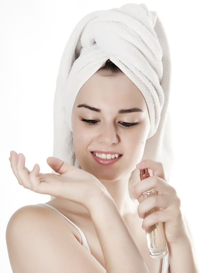 Woman applying perfume stock photo. Image of cosmetics - 26006888
