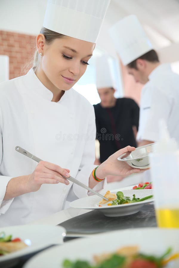 Young Woman Apprentice Decorating Dish Stock Image - Image of ...
