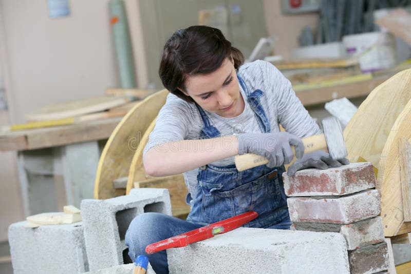 Young Woman Apprentice in Masonry Stock Photo - Image of young ...