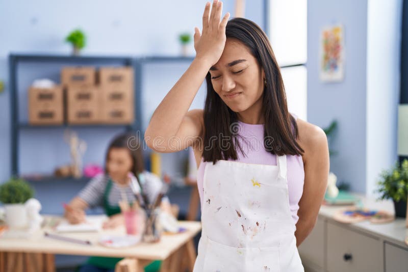 Young Woman at Art Studio Surprised with Hand on Head for Mistake ...
