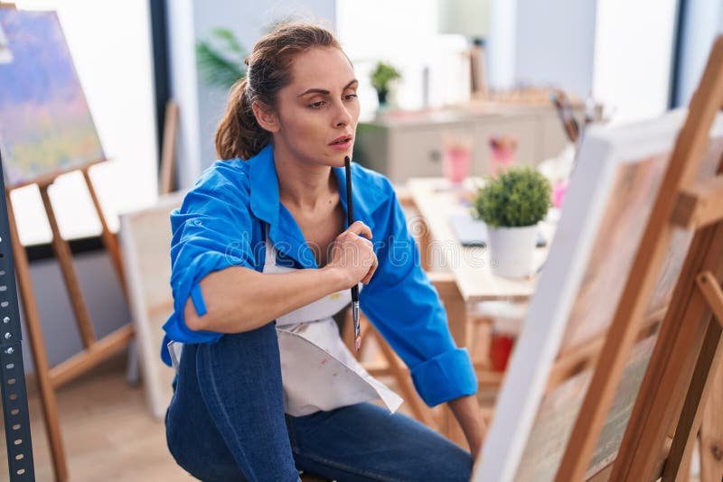 Young Woman Artist Looking Draw with Doubt Expression at Art Studio ...