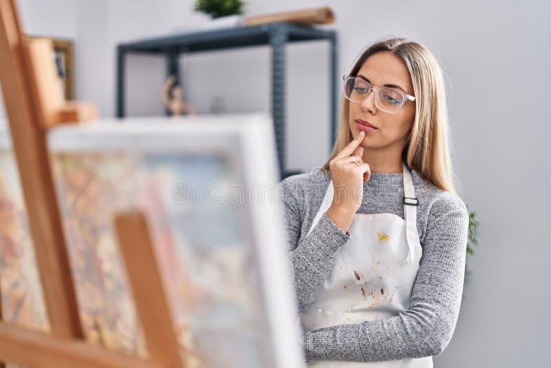 Young Woman Artist Looking Draw with Doubt Expression at Art Studio ...