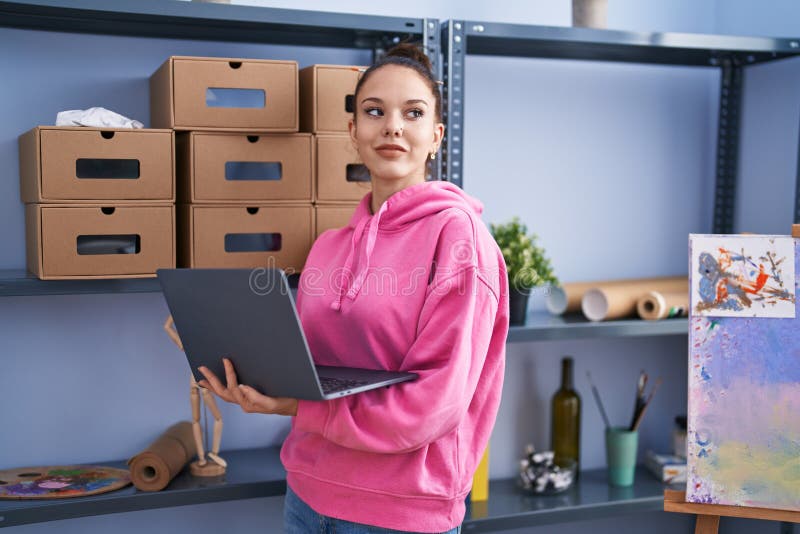 Young Woman Artist Smiling Confident Using Laptop at Art Studio Stock ...