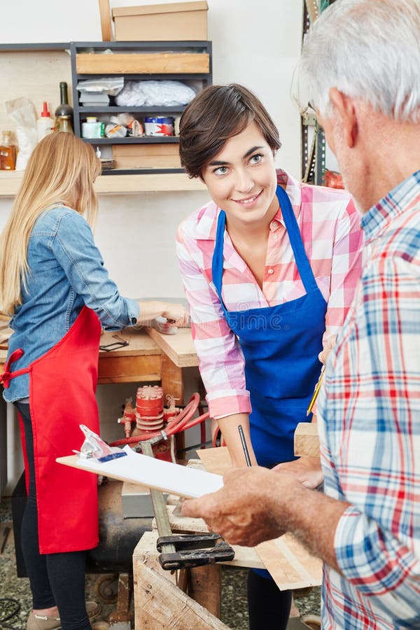 Young woman as apprentice stock photo. Image of learn - 94184940