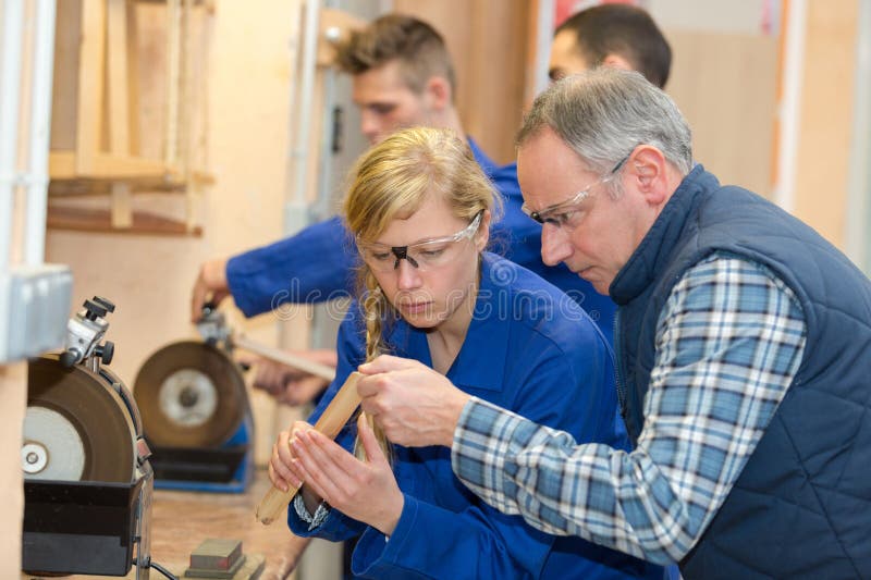 Young Woman As Apprentice in Wood Processing at Guitar Workshop Stock ...
