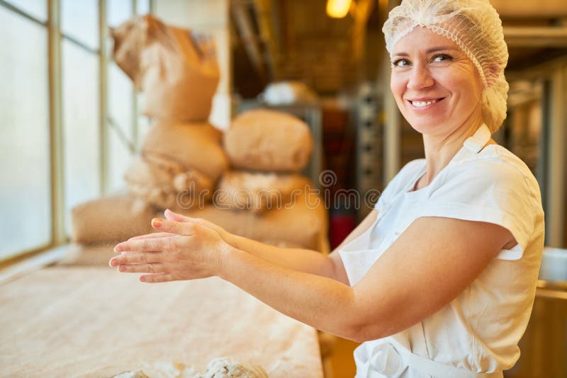 Baker Apprentice Slaps Flour from Hands Kneading Dough Stock Image ...