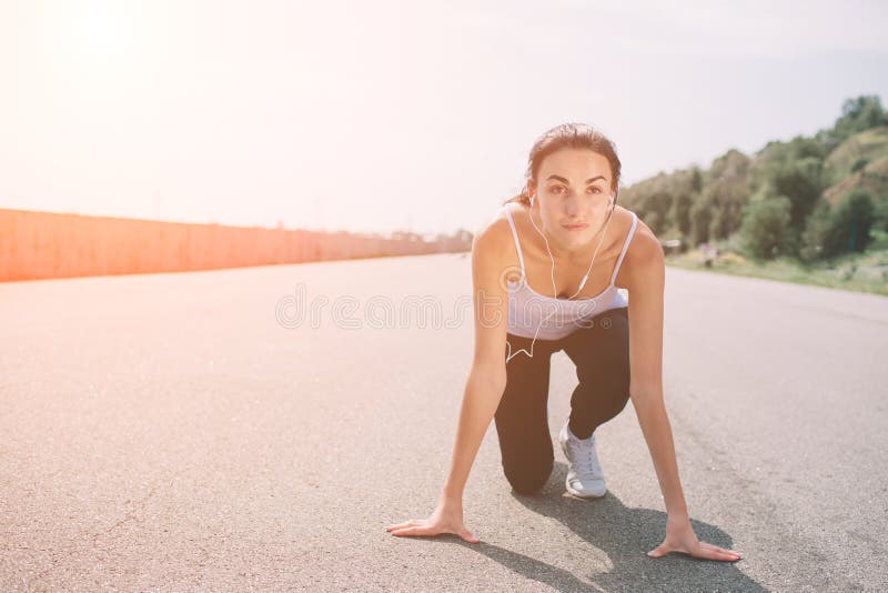 Young Woman Athlete At Starting Position Ready To Start A Race Female