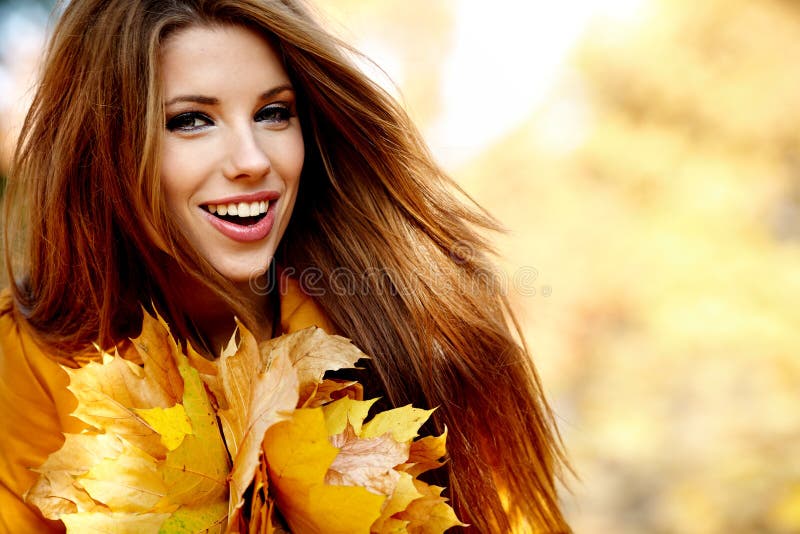 Young Woman with Autumn Leaves Stock Photo - Image of expression ...