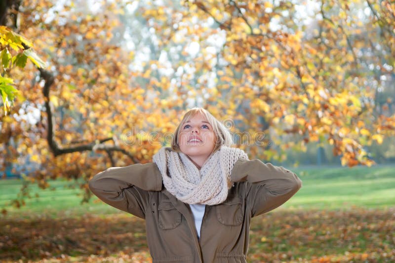 Young woman in autumn park stock image. Image of color - 22344551