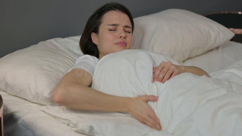 Young Woman with Back Pain Laying in Bed Stock Image - Image of females ...