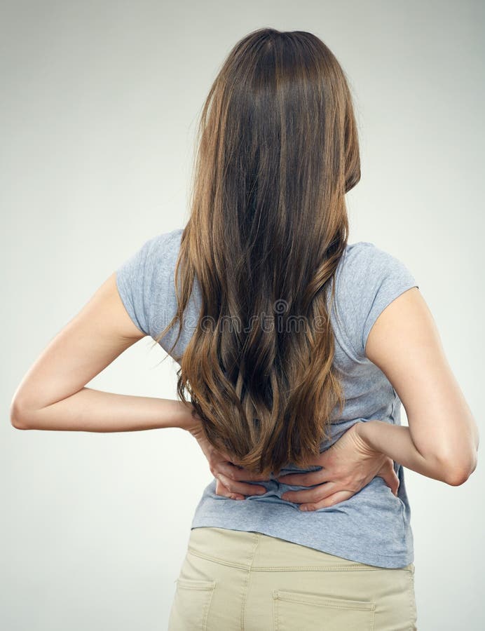 Young woman with back pain stock photo. Image of backache - 99416040