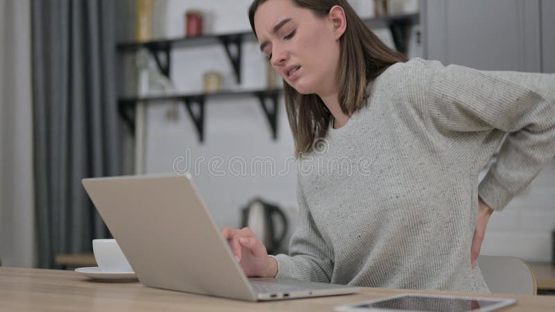 Young Woman with Back Pain Working on Laptop Stock Photo - Image of ...