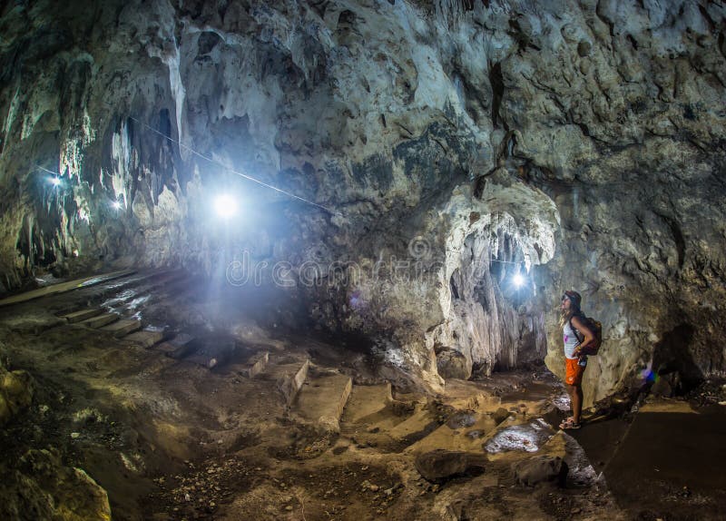 Young Woman with Backpack Exploring Cave Stock Photo - Image of ...