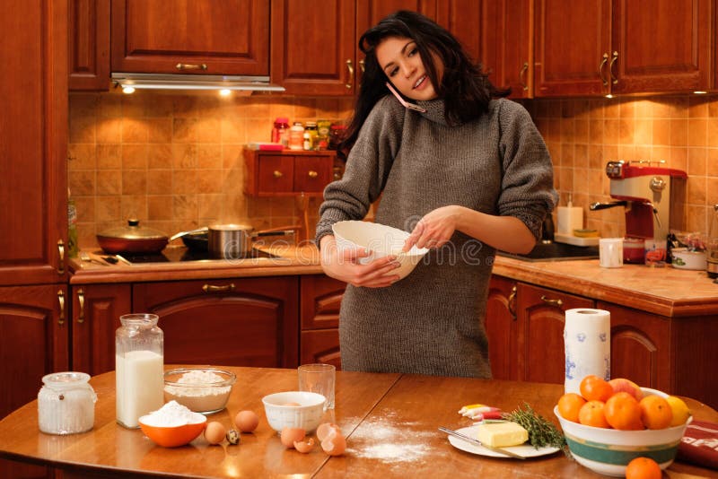 Young woman baking at home stock image. Image of female - 83429621