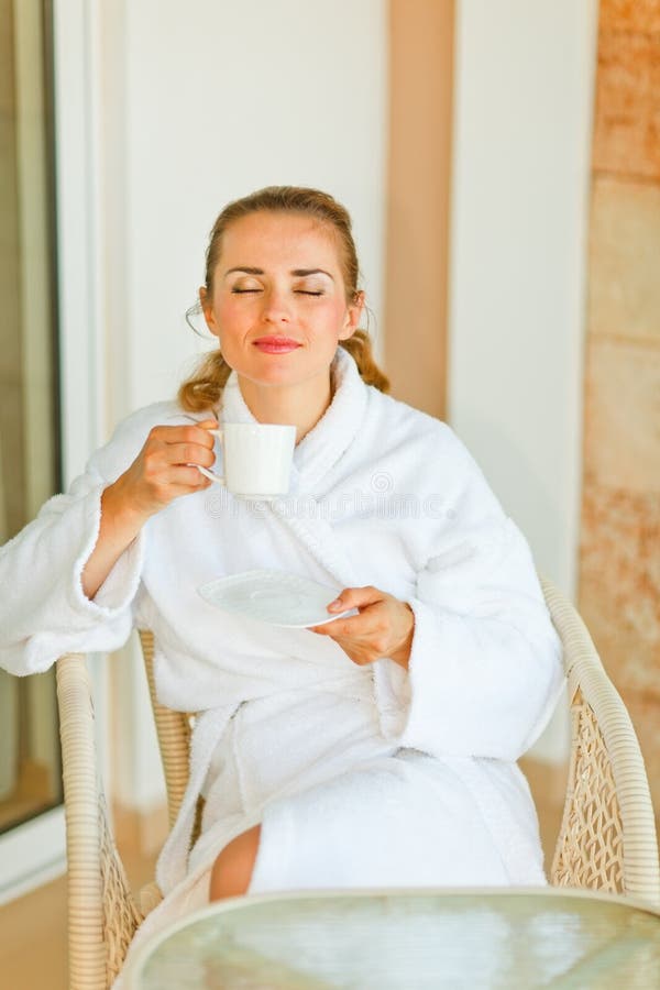 Young Woman in Bathrobe Enjoying Cup of Coffee Stock Photo - Image of ...