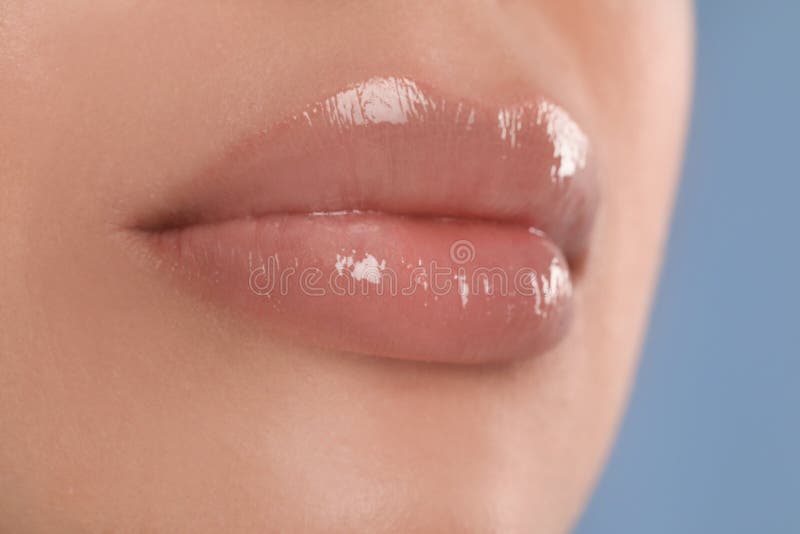 Young Woman with Beautiful Full Lips on Blue Background, Closeup Stock ...