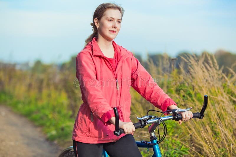 Young woman with bicycle stock photo. Image of healthy - 16656486
