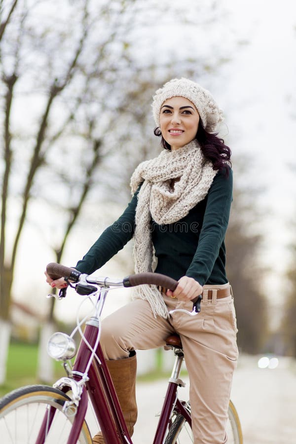 Young woman on the bicycle stock image. Image of adult - 28269787