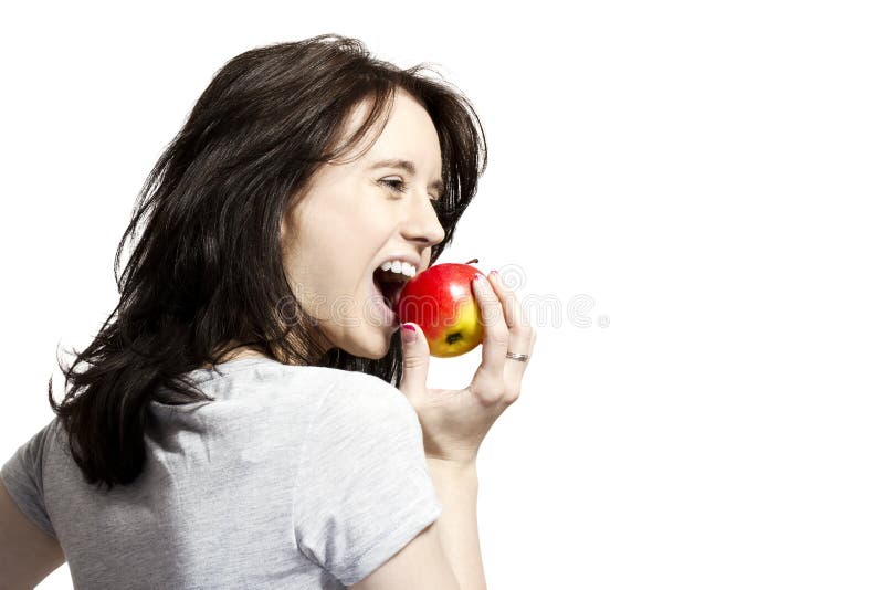 Young Woman Biting in Red Apple Stock Photo - Image of hair, healthy ...
