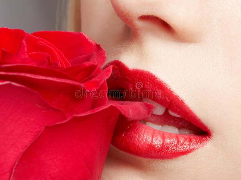 Girl biting lily flower stock photo. Image of caucasian - 13477086