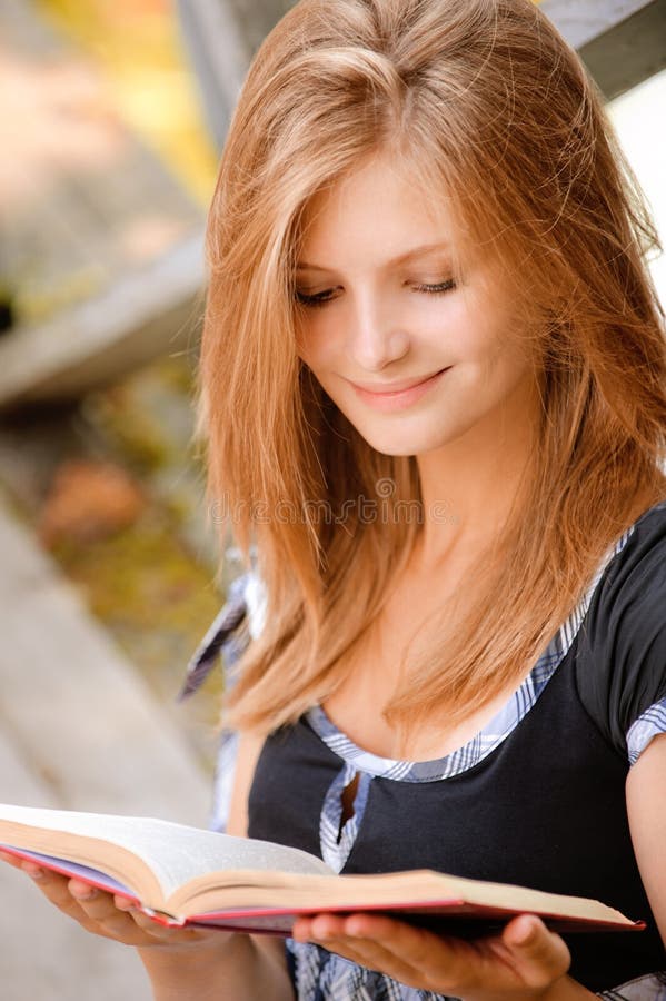 Young woman with book stock photo. Image of blurred, face - 15503882