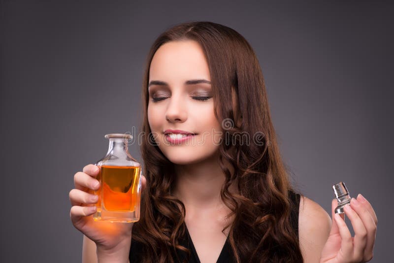 The Young Woman with Bottle of Perfume Stock Photo - Image of aroma ...