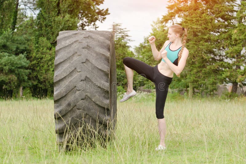 Young Woman Boxing with the Tire. Workout Stock Image - Image of foot ...