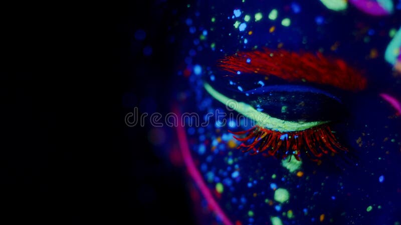 Young Woman in Bright Fluorescent Makeup Glowing Under UV Light ... Young Woman in Bright Fluorescent Makeup Glowing Under UV Light ...