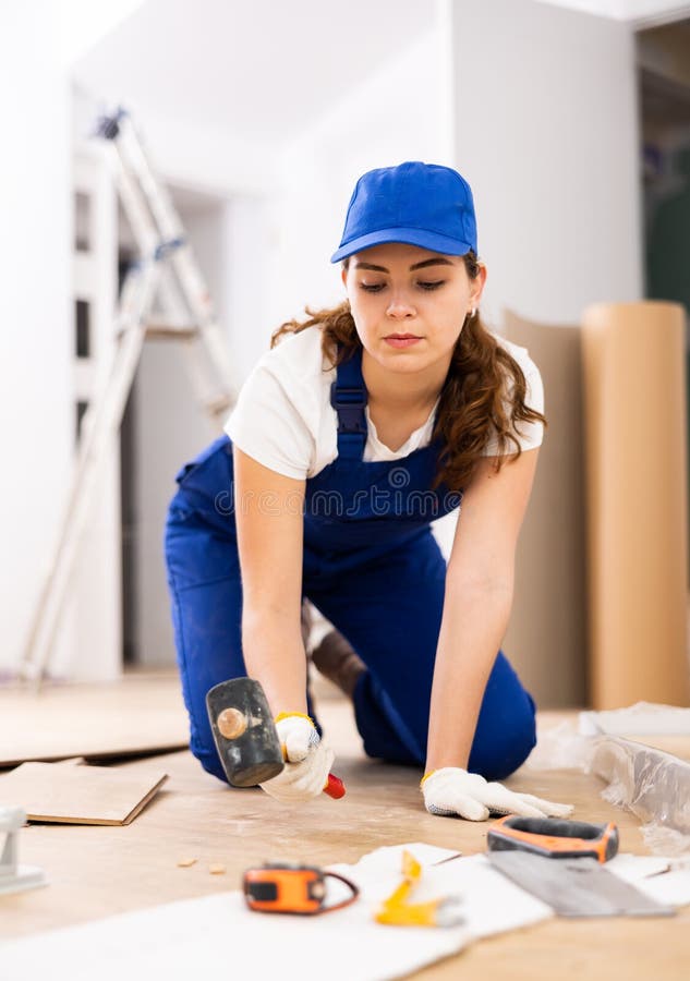 Young Woman Builder Installing Parquet Stock Image - Image of repair ...