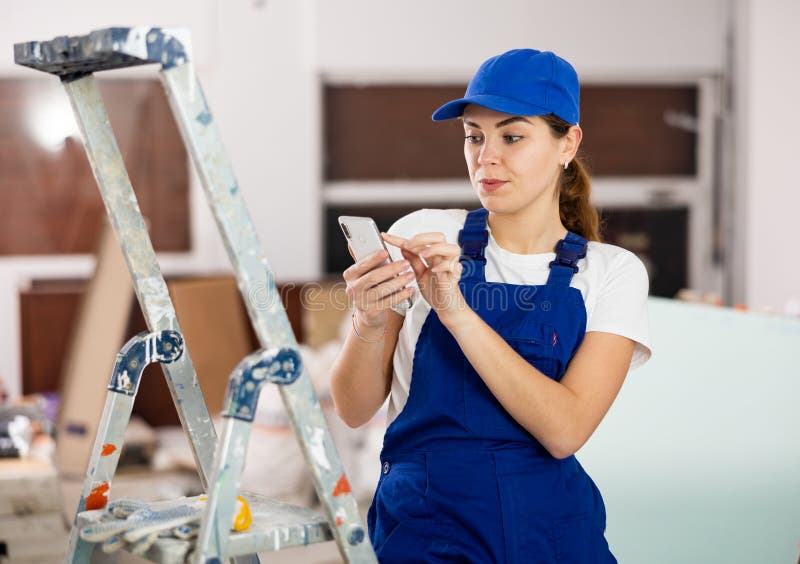 Builder Using Phone. Portrait of Builder Man. Construction Worker with Hardhat Helmet on ...