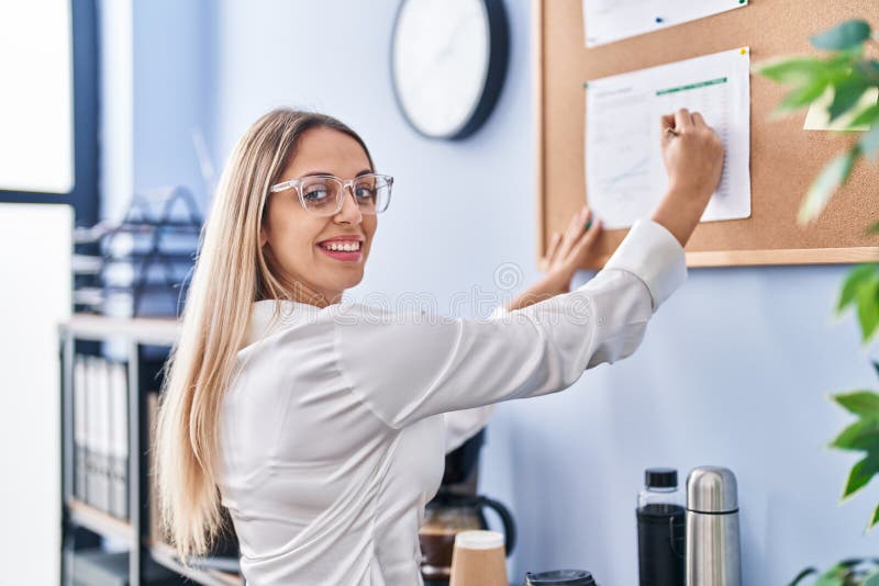 Young Woman Business Worker Writing on Cork Board at Office Stock Photo ...