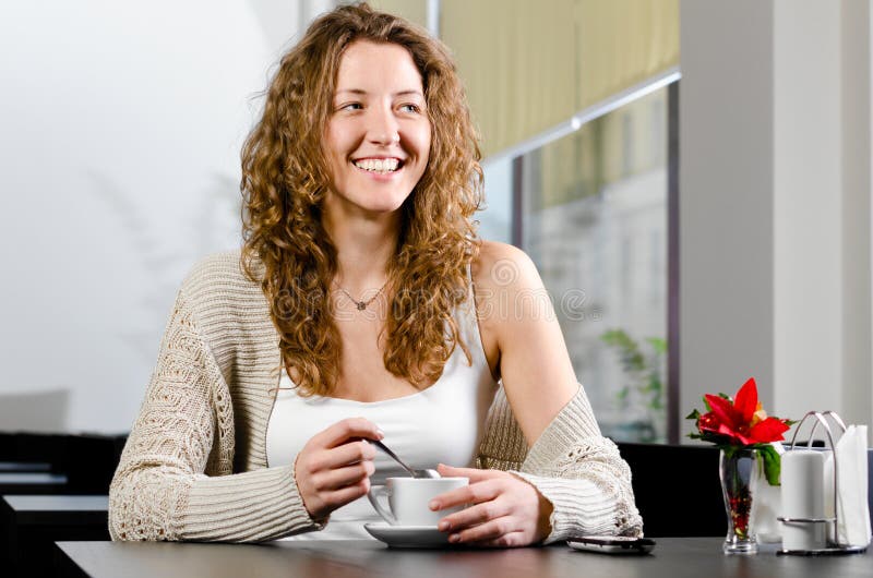 Young woman at cafe stock image. Image of people, indoors - 22456111