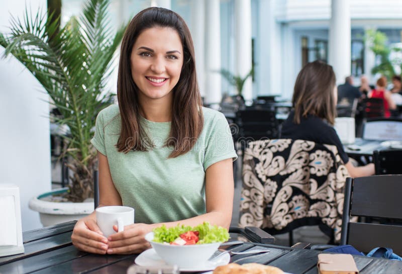Young woman in a cafe stock photo. Image of adult, female - 102798274