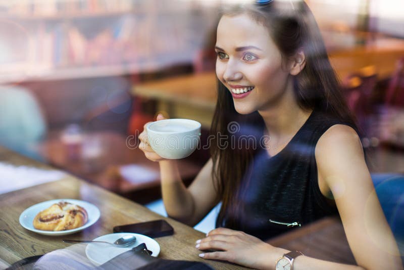 Young woman at cafe stock image. Image of joyful, restaurant - 67640423