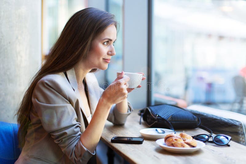 Young woman at cafe stock image. Image of lifestyle, woman - 67640599