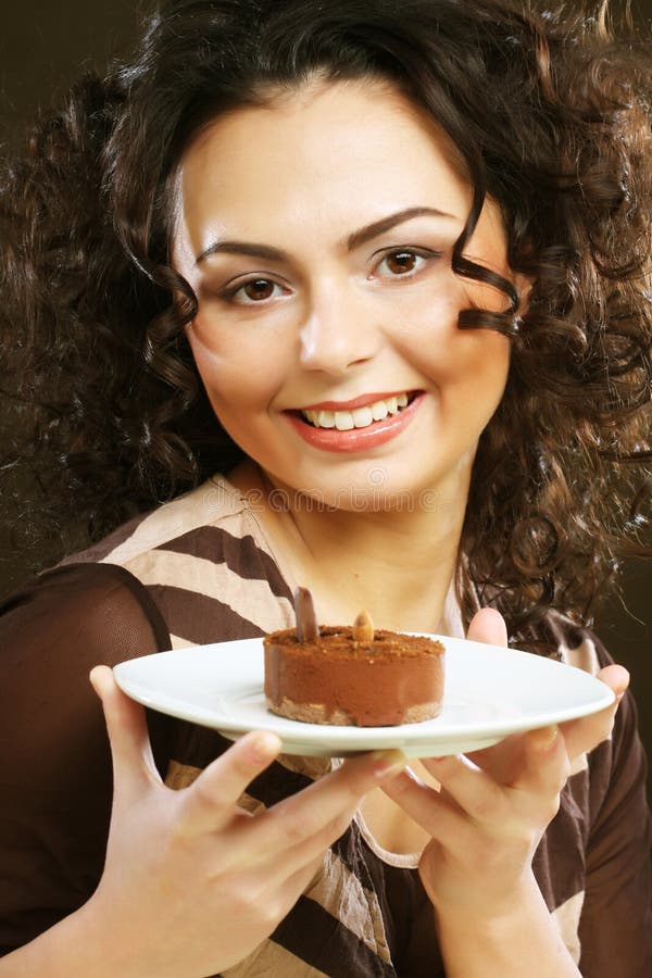Young woman with a cake stock photo. Image of appetite - 38676710