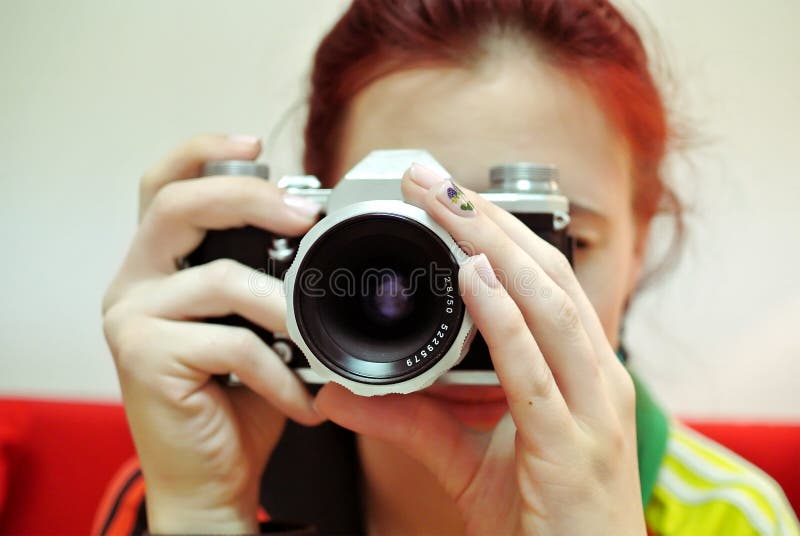 Young woman with camera stock photo. Image of room, model - 48501510
