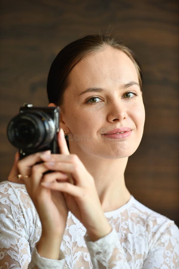 Young woman with camera stock photo. Image of young - 155608770