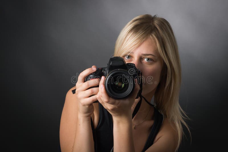 Young woman with camera stock image. Image of beauty - 58453447