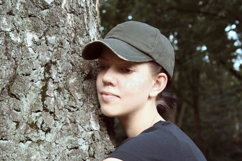 Young Woman with Cap and Tree Stock Image - Image of face, white: 1324921