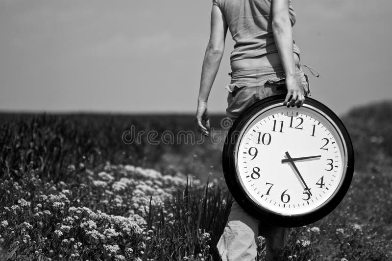 Young Woman Carrying a Big Clock on a Field Stock Image - Image of ...